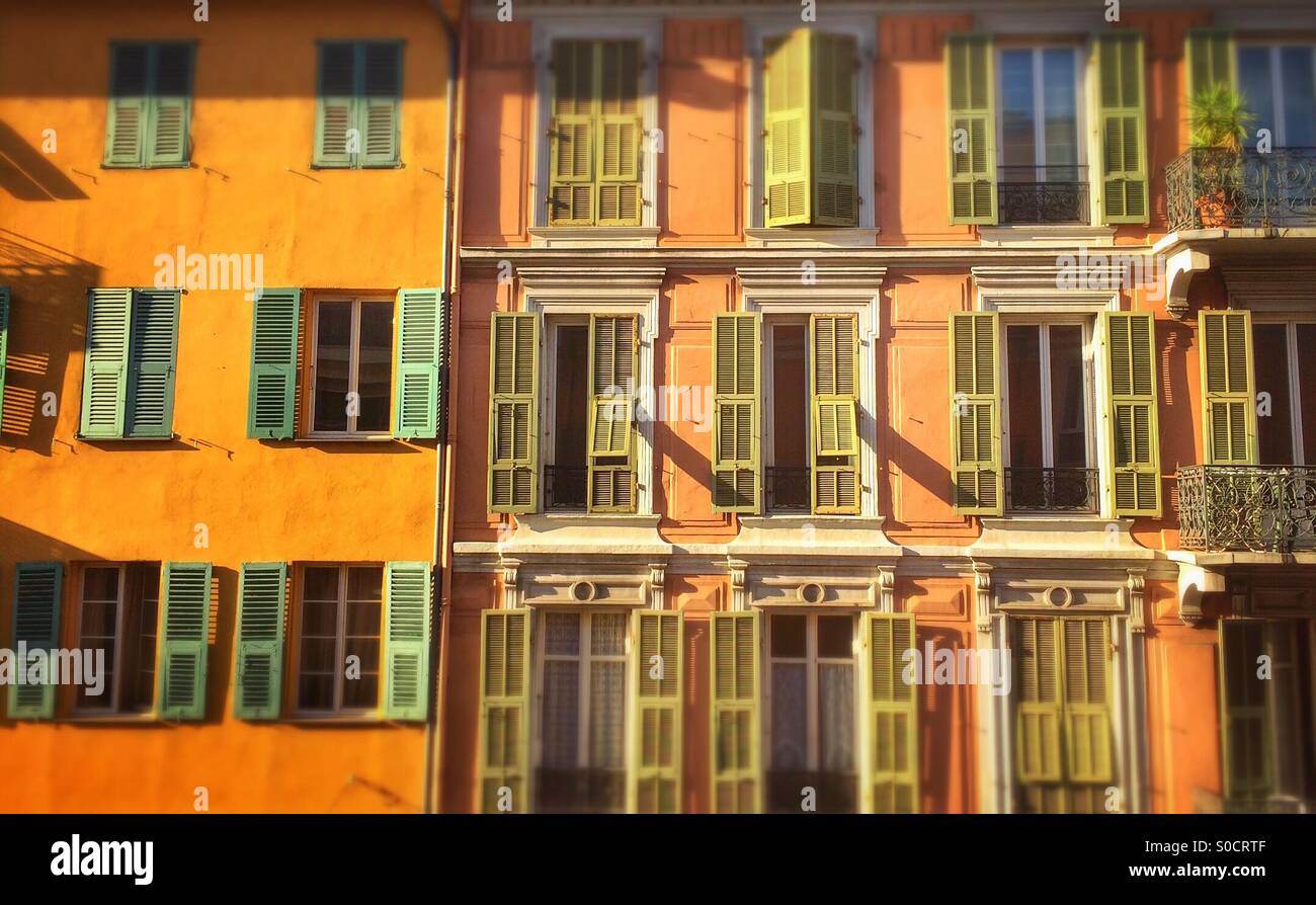 Windows and shutters on a traditional apartment building on the French ...
