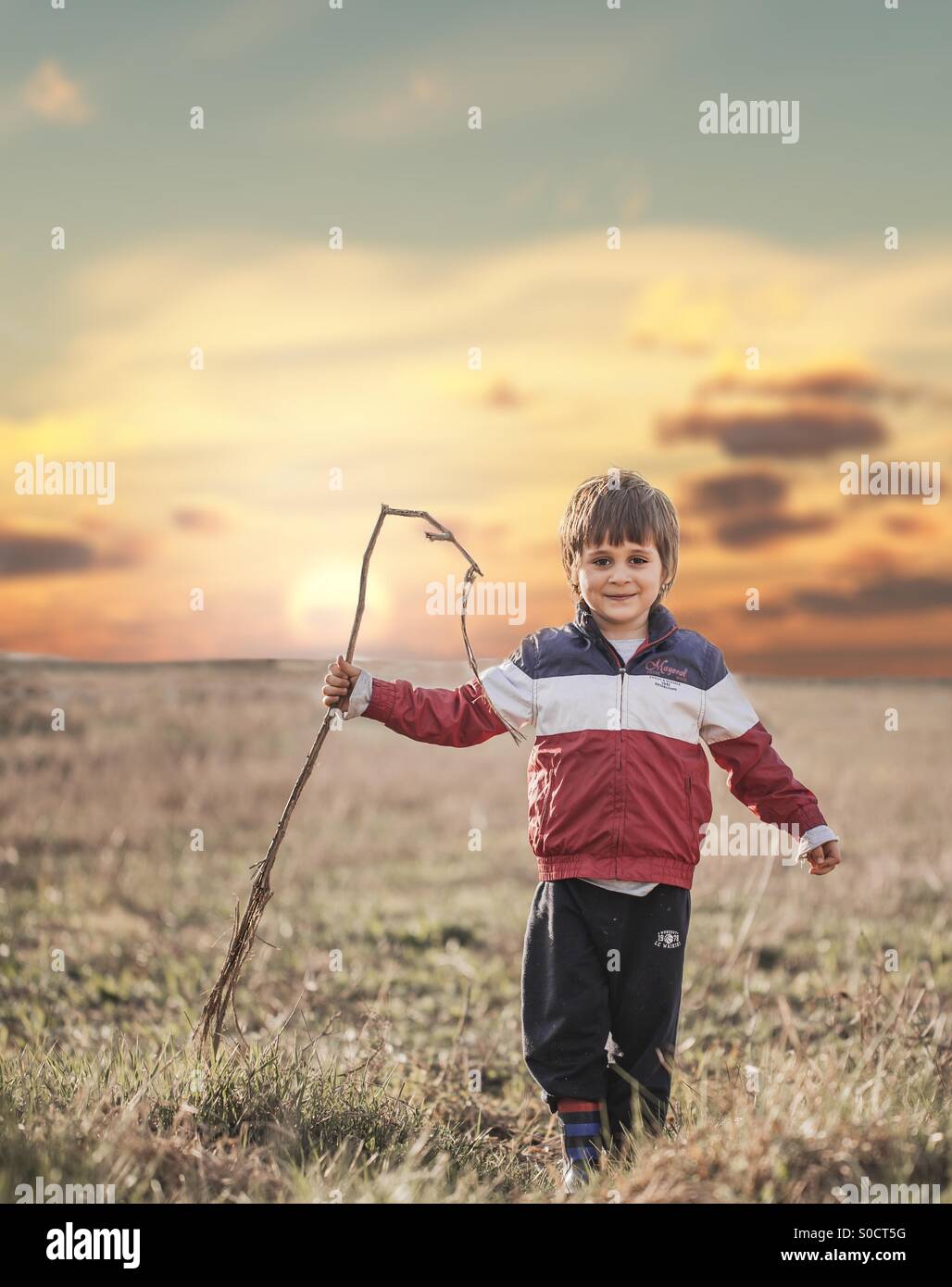Little boy with sunset Stock Photo - Alamy