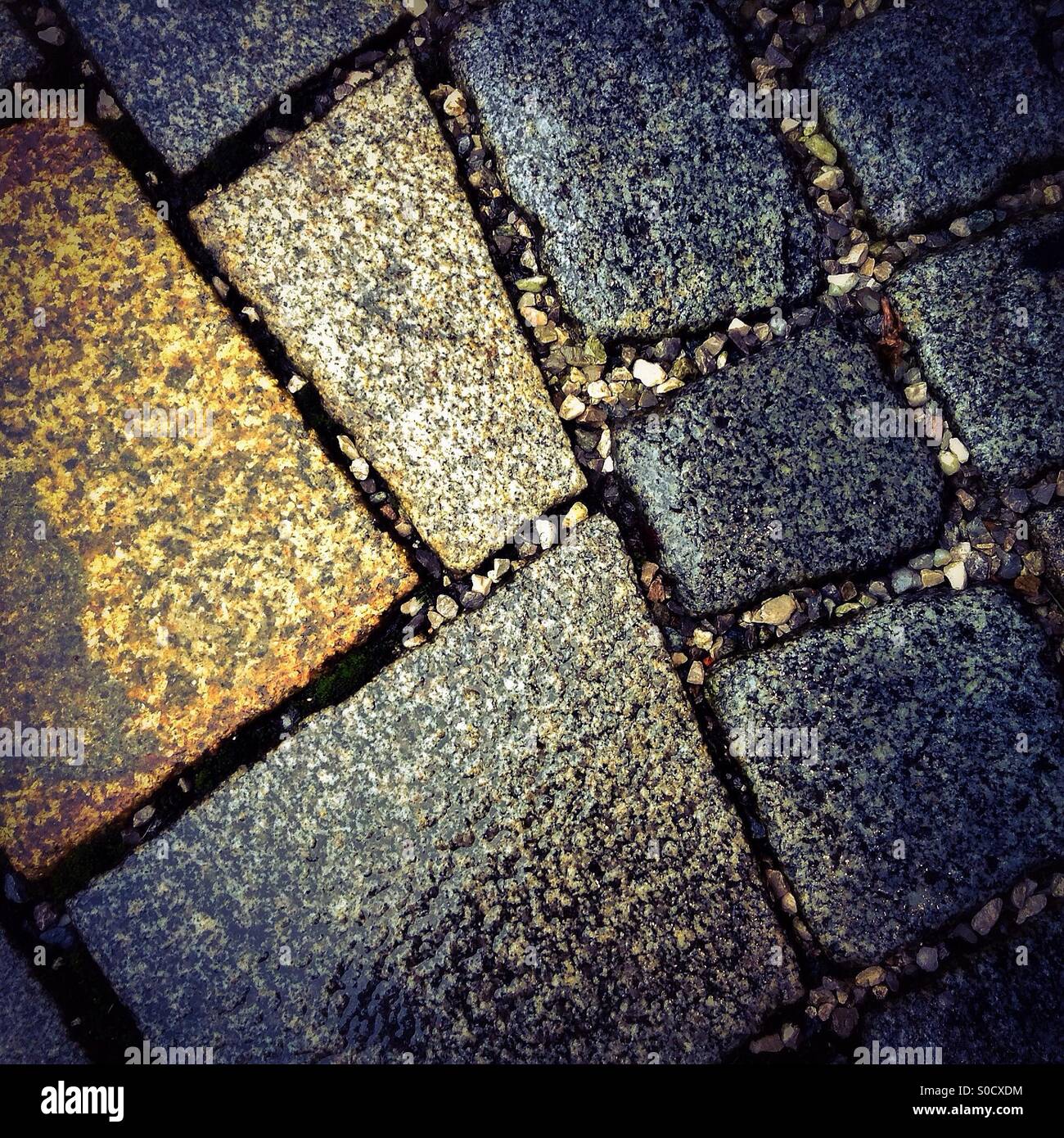 Wet cobblestone pavement Stock Photo - Alamy