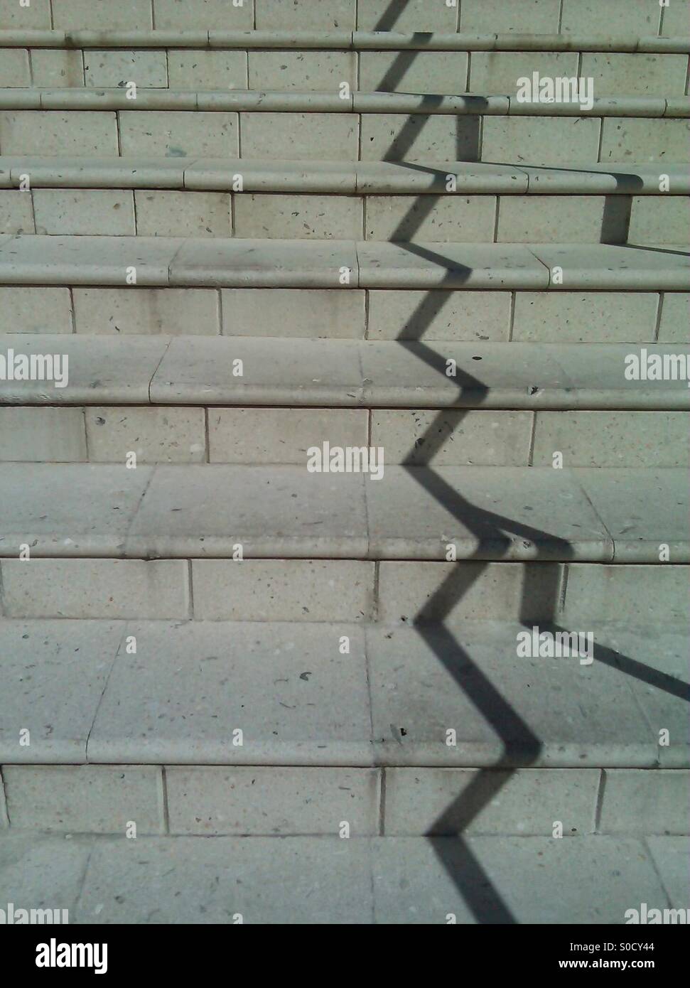 Zigzag shadow on stone steps Stock Photo - Alamy