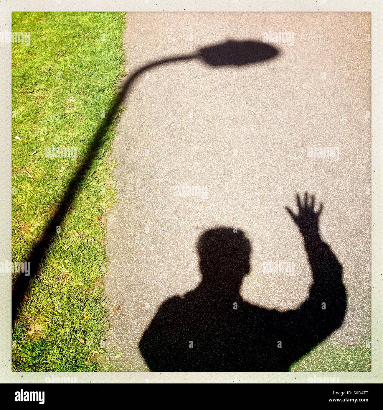 Man lamp post shadow hi-res stock photography and images - Alamy