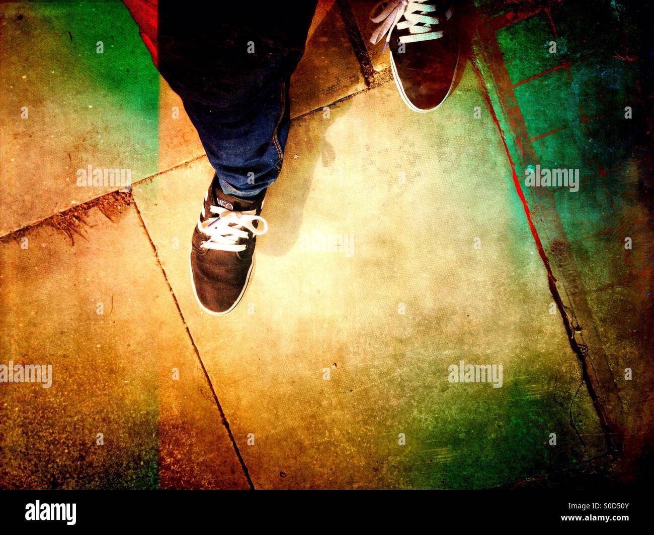 Feet on a pavement Stock Photo - Alamy