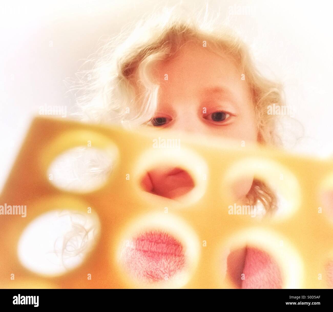 Young girl concentrating playing a game of four in a row Stock Photo ...