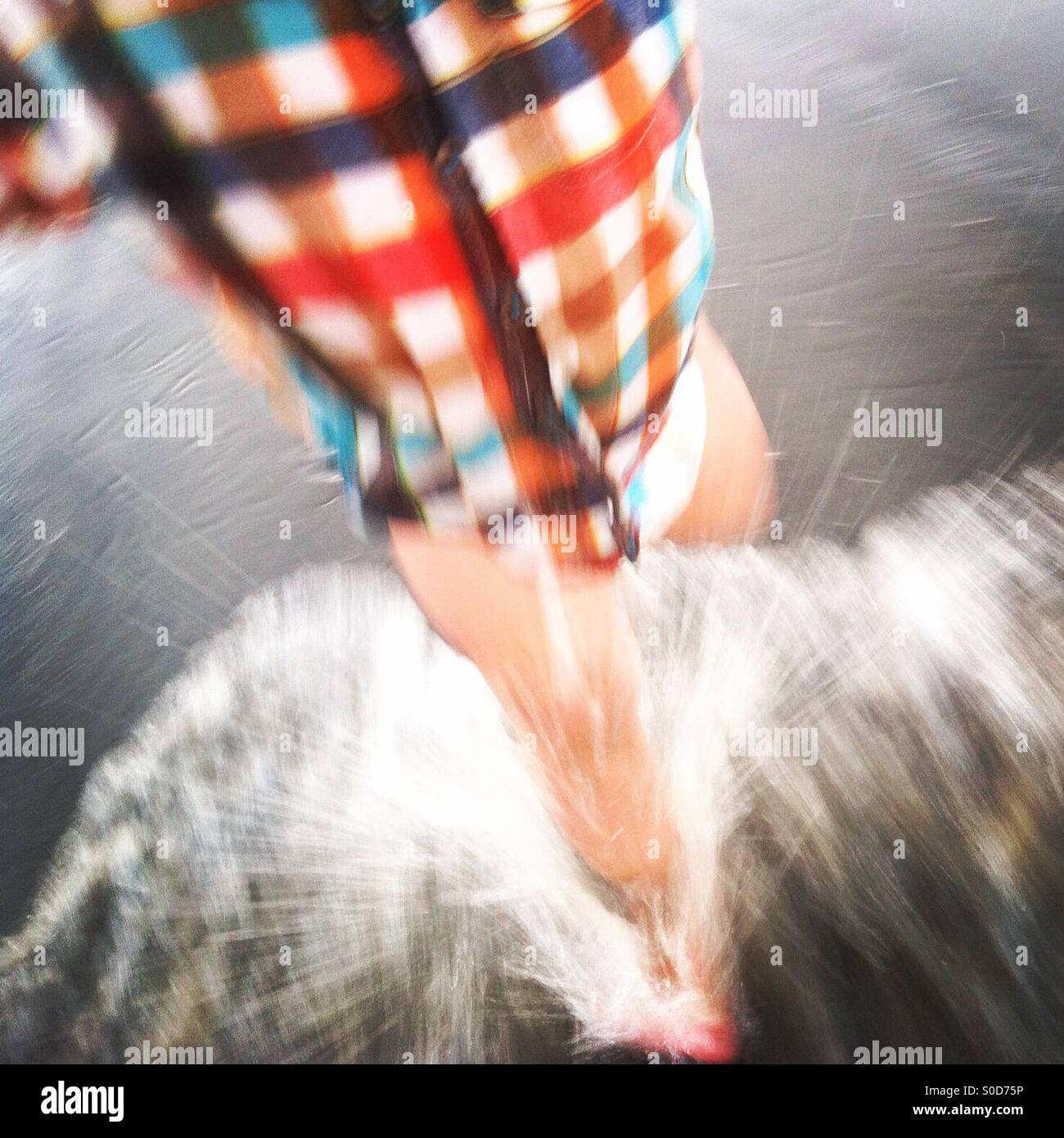 Detail of a toddler running through the waves Stock Photo - Alamy