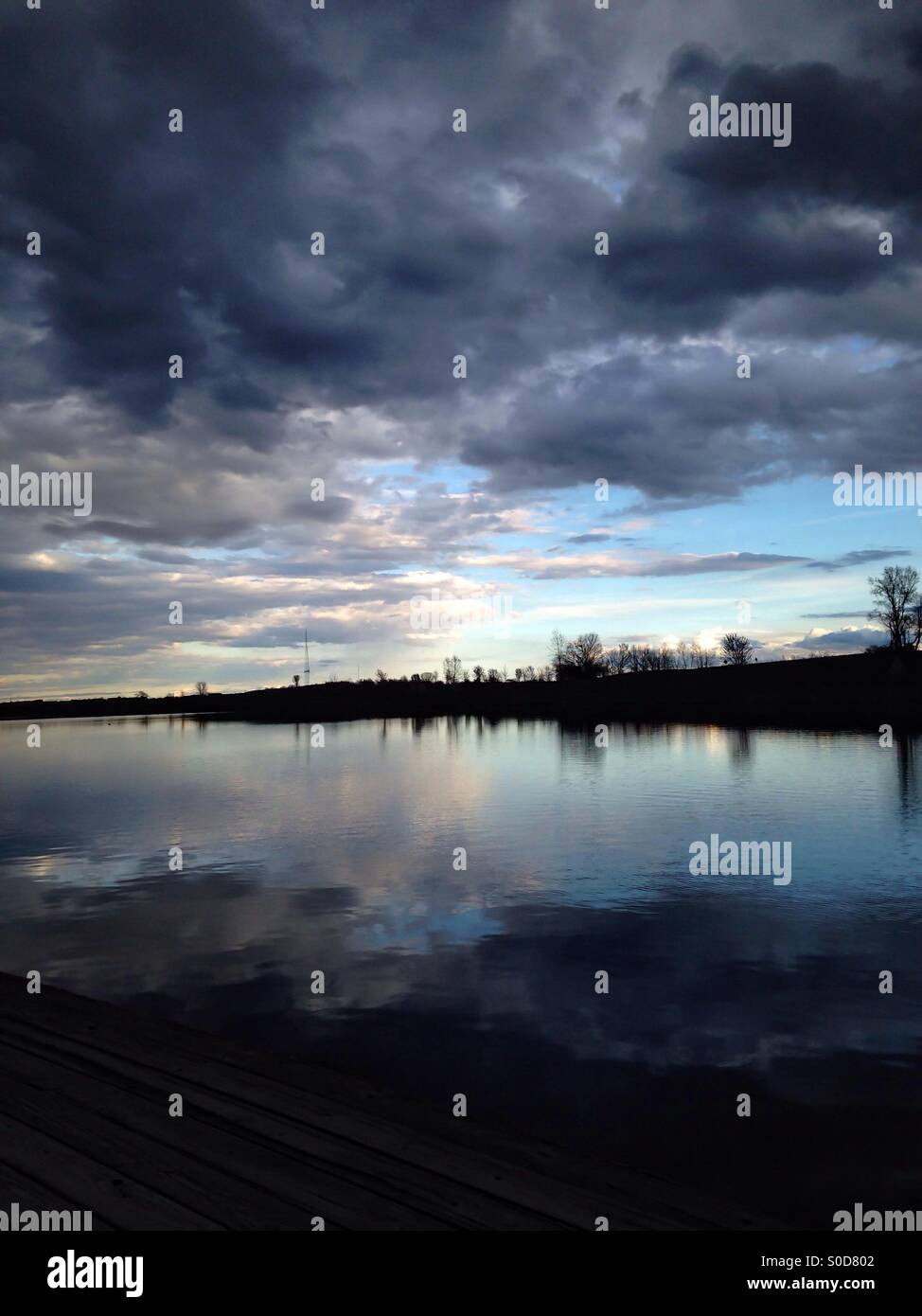 Dark clouds over a lake hi-res stock photography and images - Alamy