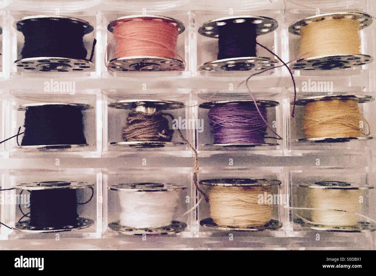 Mini spools of thread Stock Photo - Alamy