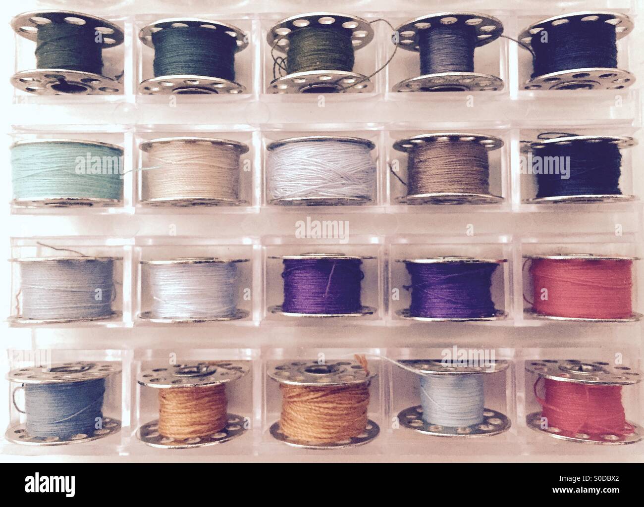 Multiple mini spools of thread Stock Photo - Alamy