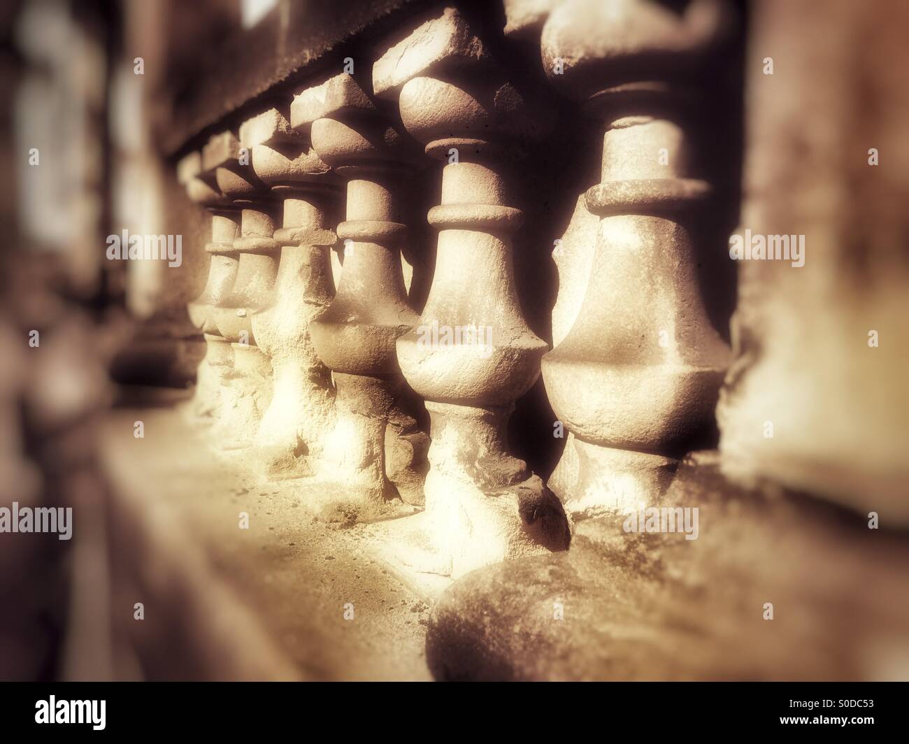 Row of Carved stone pillars Stock Photo - Alamy