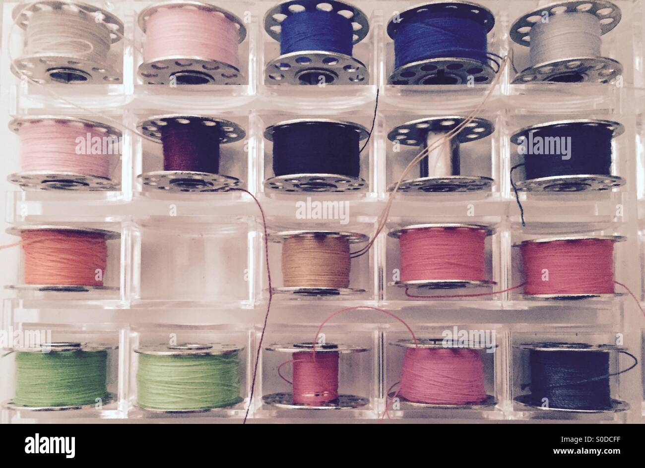 Mini spools of thread Stock Photo - Alamy
