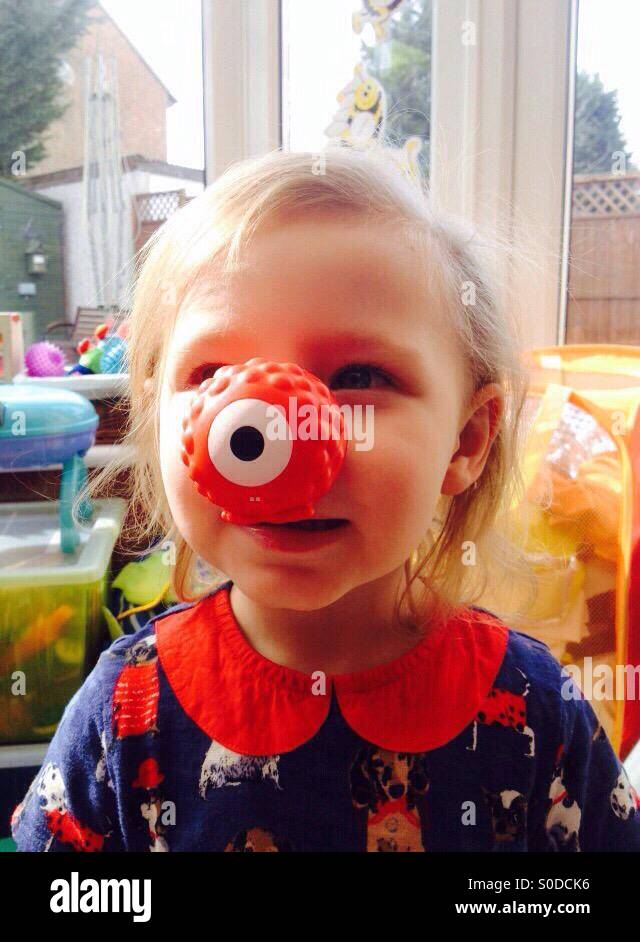 Young girl with red nose Stock Photo - Alamy