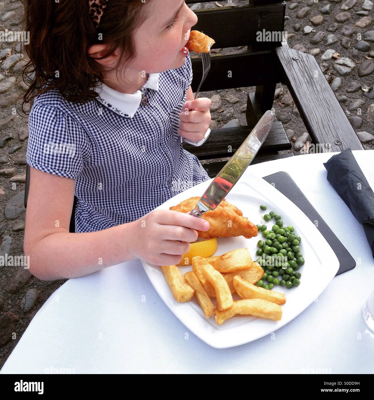 Child eating fish and chips hi-res stock photography and images - Alamy