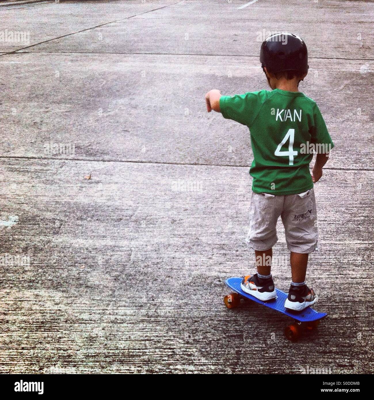 Young child skating Stock Photo - Alamy