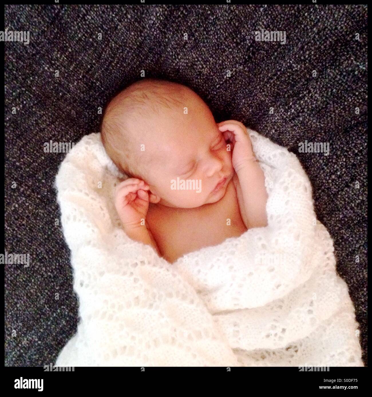 Baby wrapped in white hi-res stock photography and images - Alamy