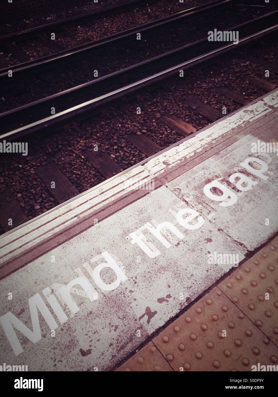 Mind the gap sign in a London Underground platform Stock Photo - Alamy