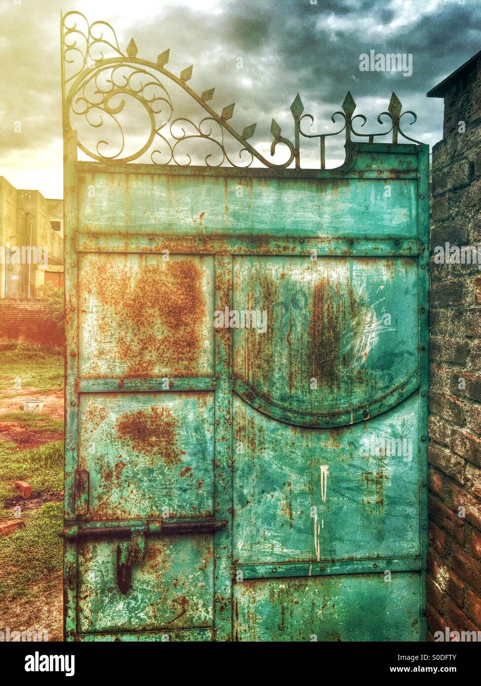 Old rusty metal gate in Kharian village Pakistan Stock Photo - Alamy