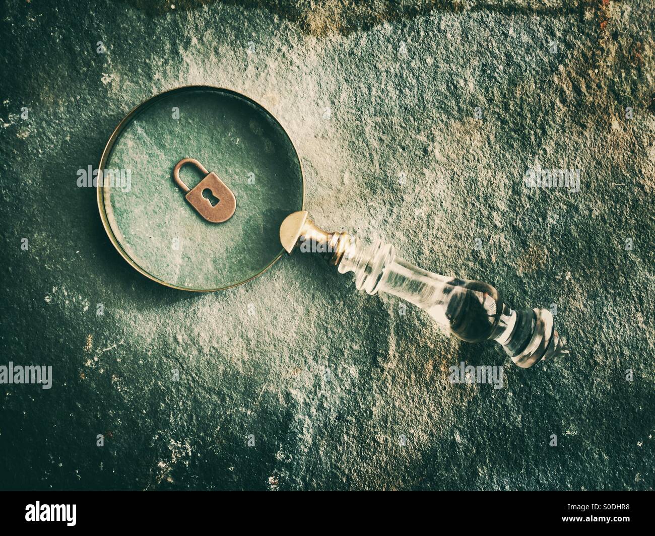 Magnifying glass and lock Stock Photo - Alamy