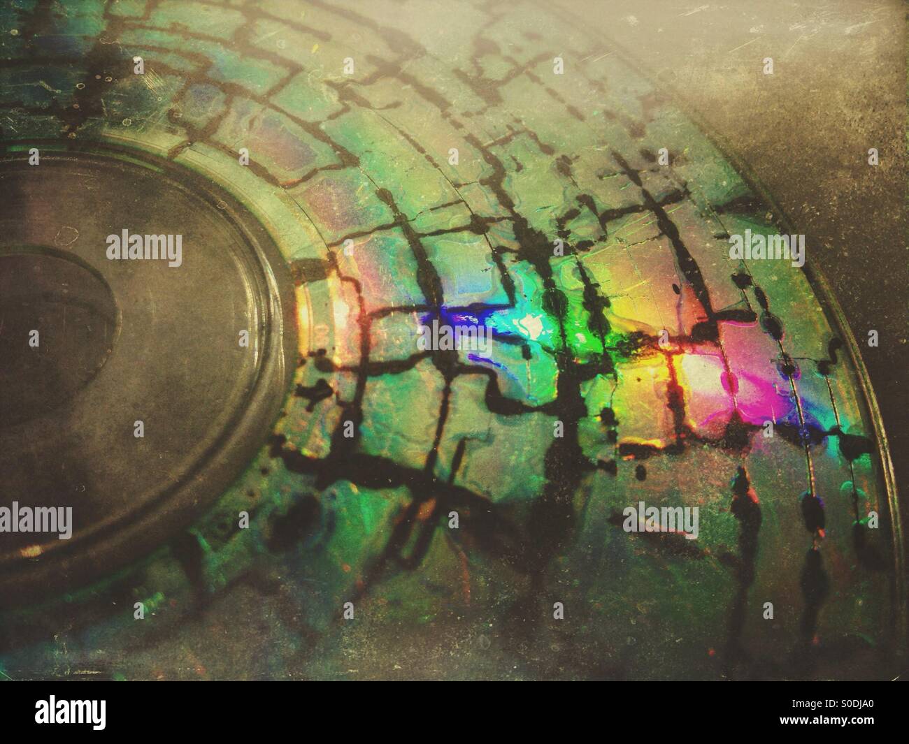 Rainbow effect on an old destroyed CD Stock Photo - Alamy