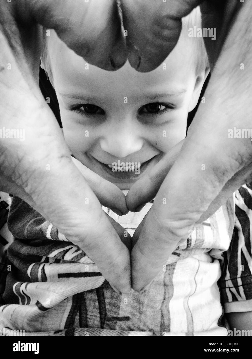 Child hands heart shape face hi-res stock photography and images - Alamy