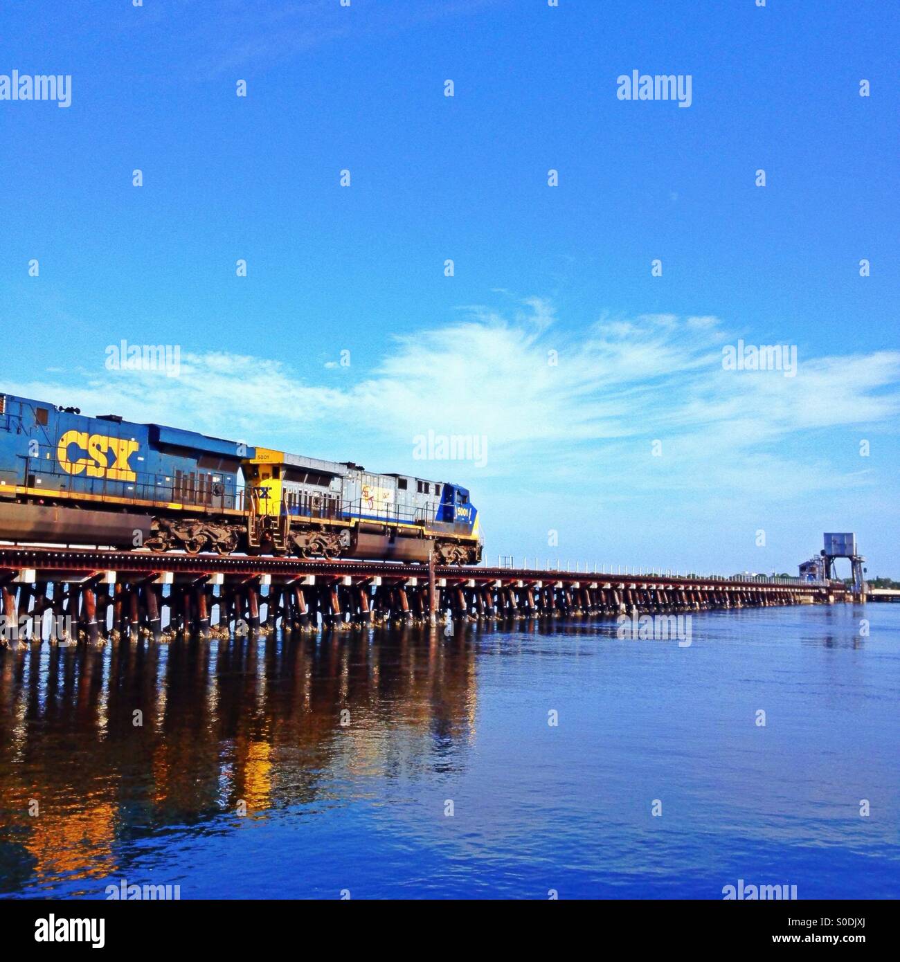 Railroad train crossing a bridge Stock Photo - Alamy