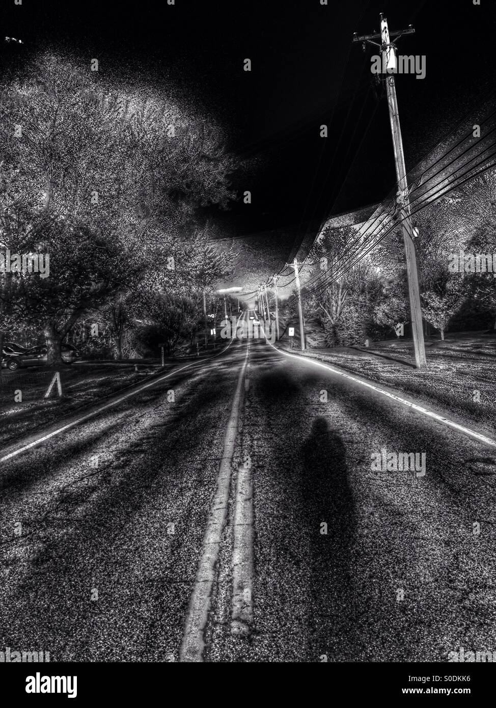 A shadow casted on a long road (3 Stock Photo - Alamy