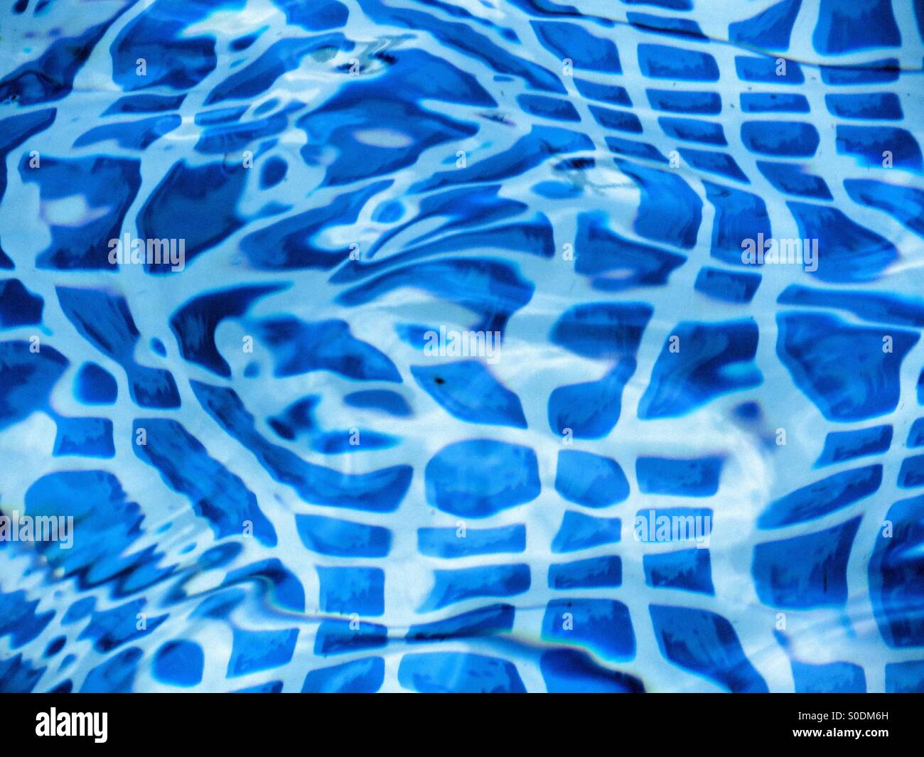 Water distorted pattern in a swimming pool Stock Photo - Alamy