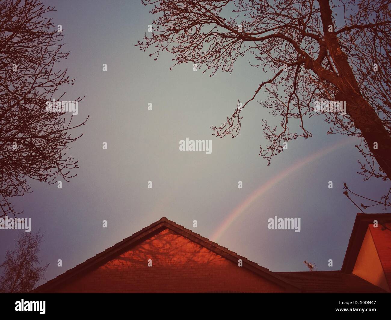 Rainbow over house Manchester UK Stock Photo - Alamy