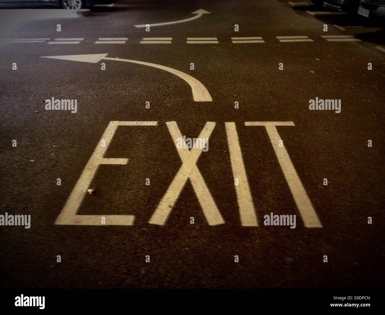 Road markings giving directions to the exit Stock Photo - Alamy