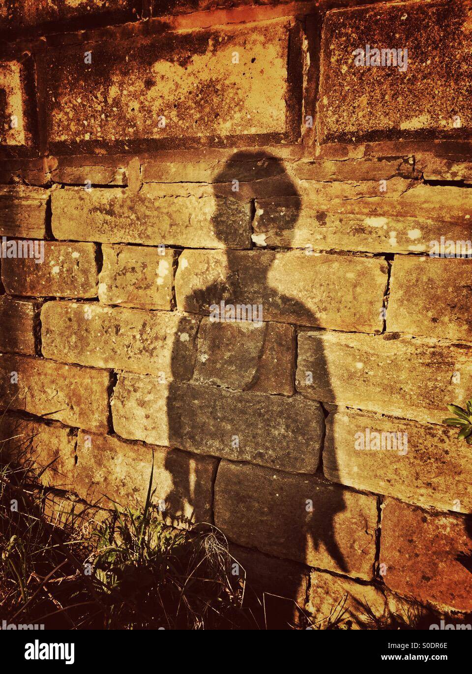Shadow of a little boy standing outdoors Stock Photo - Alamy