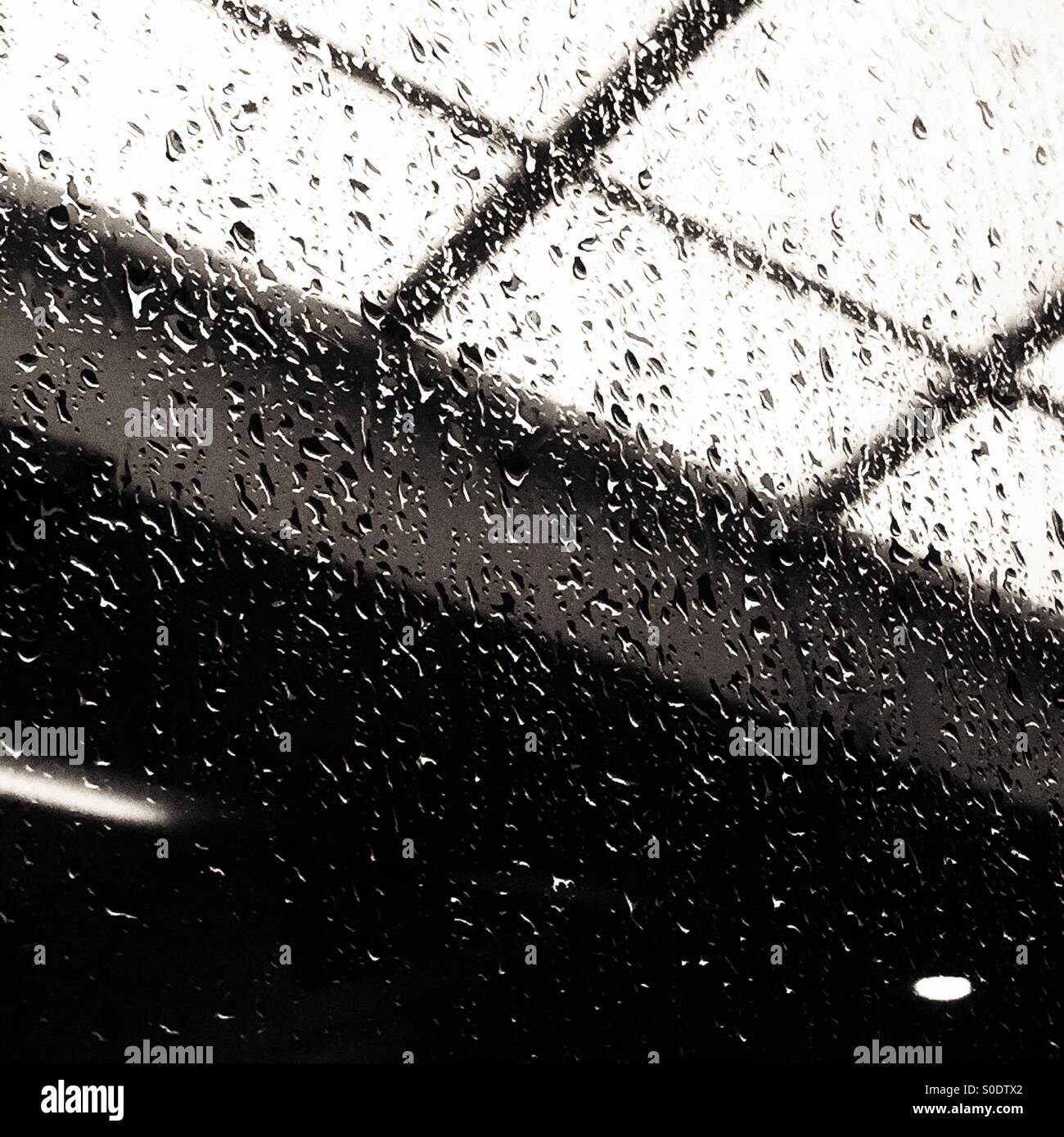 Raindrops on a modern window Stock Photo - Alamy