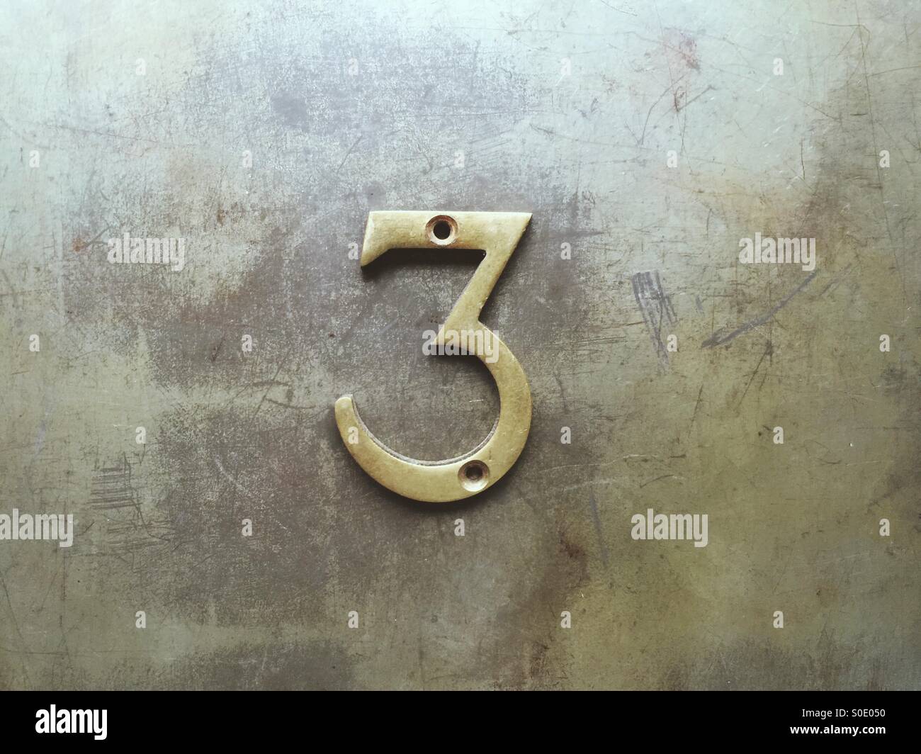 Metal number 3 Stock Photo - Alamy