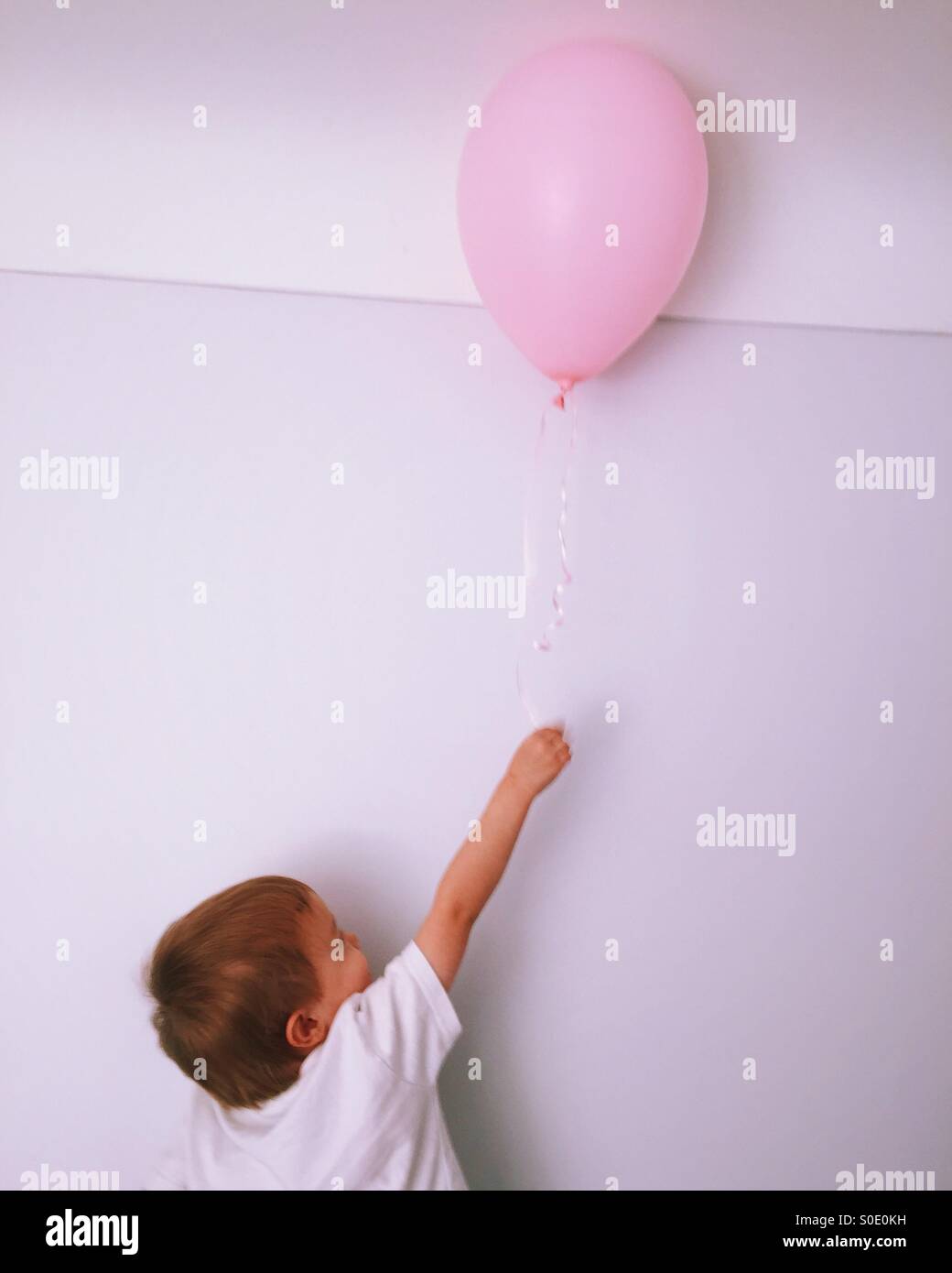 Child grabbing hi-res stock photography and images - Alamy