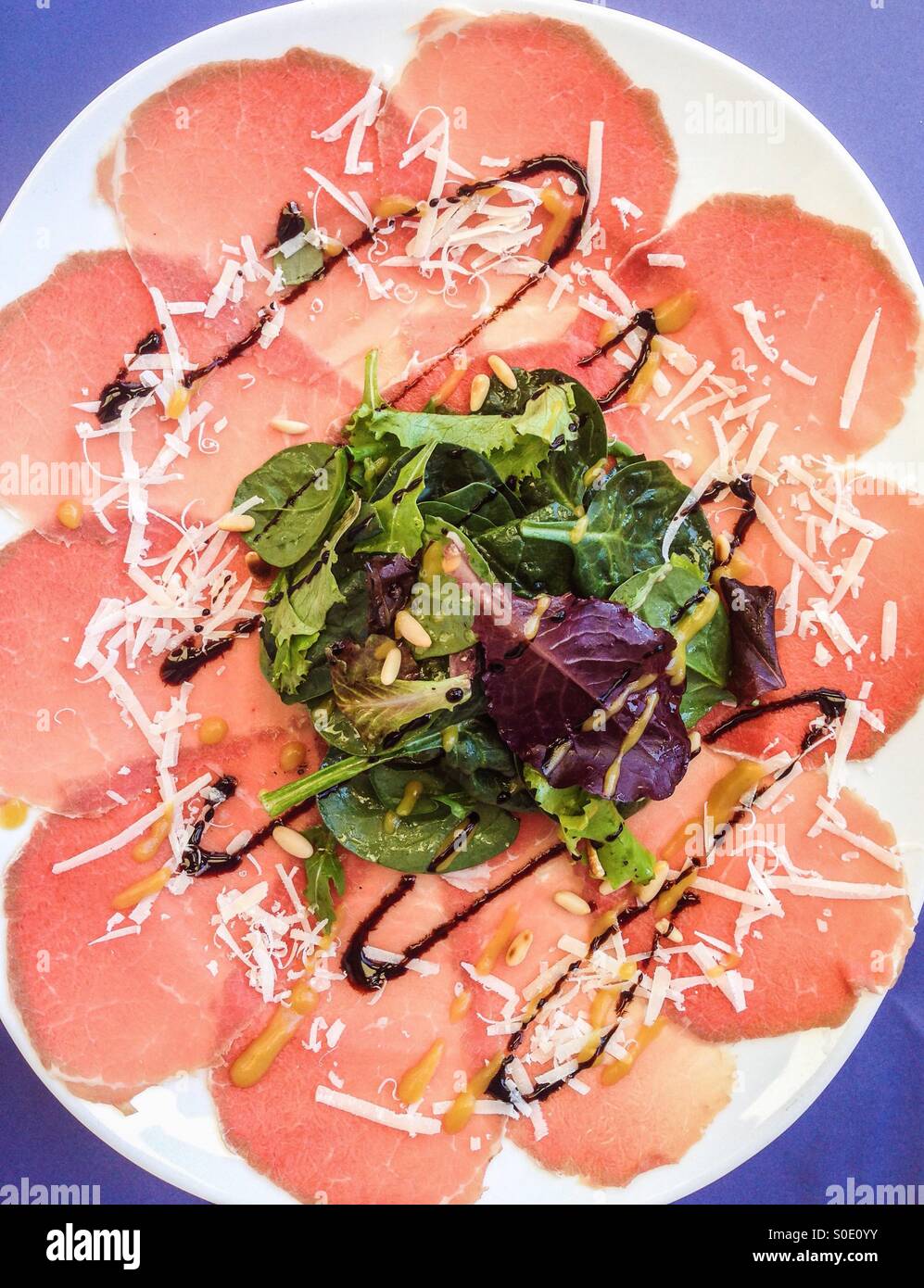 Beef Carpaccio and dressing Stock Photo - Alamy