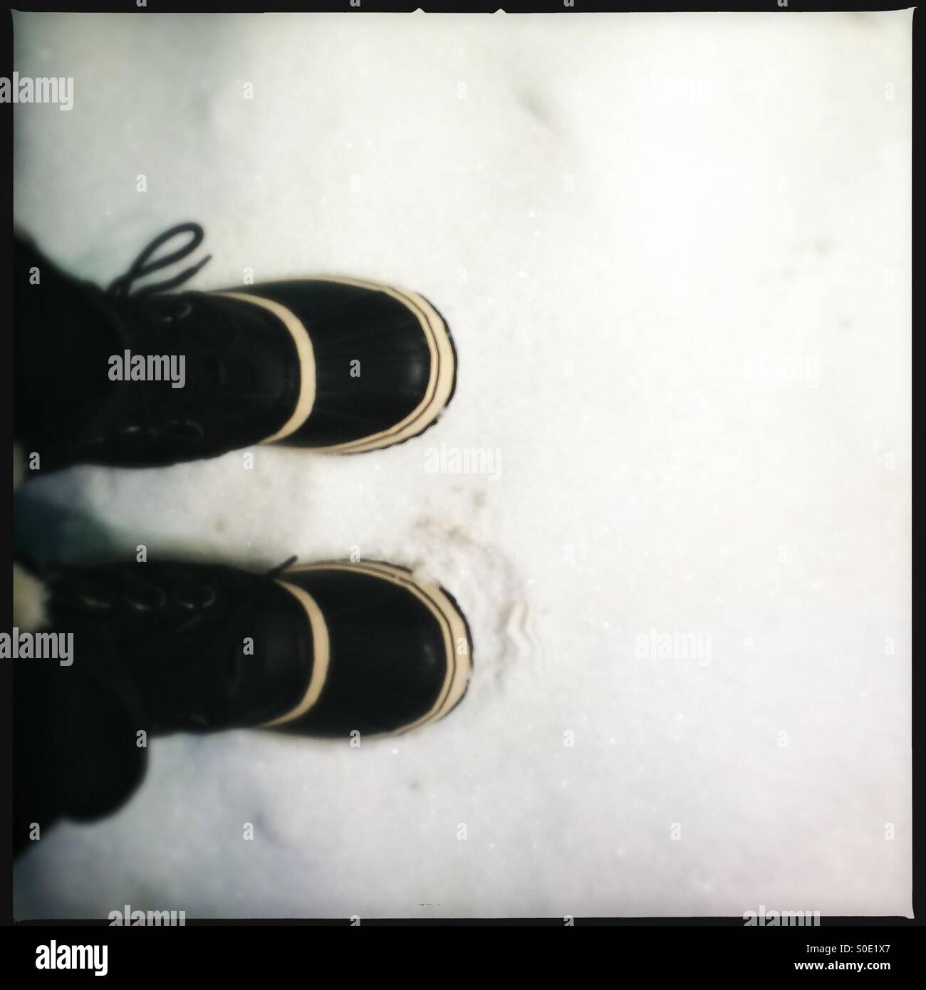 Winter boots in snow Stock Photo - Alamy