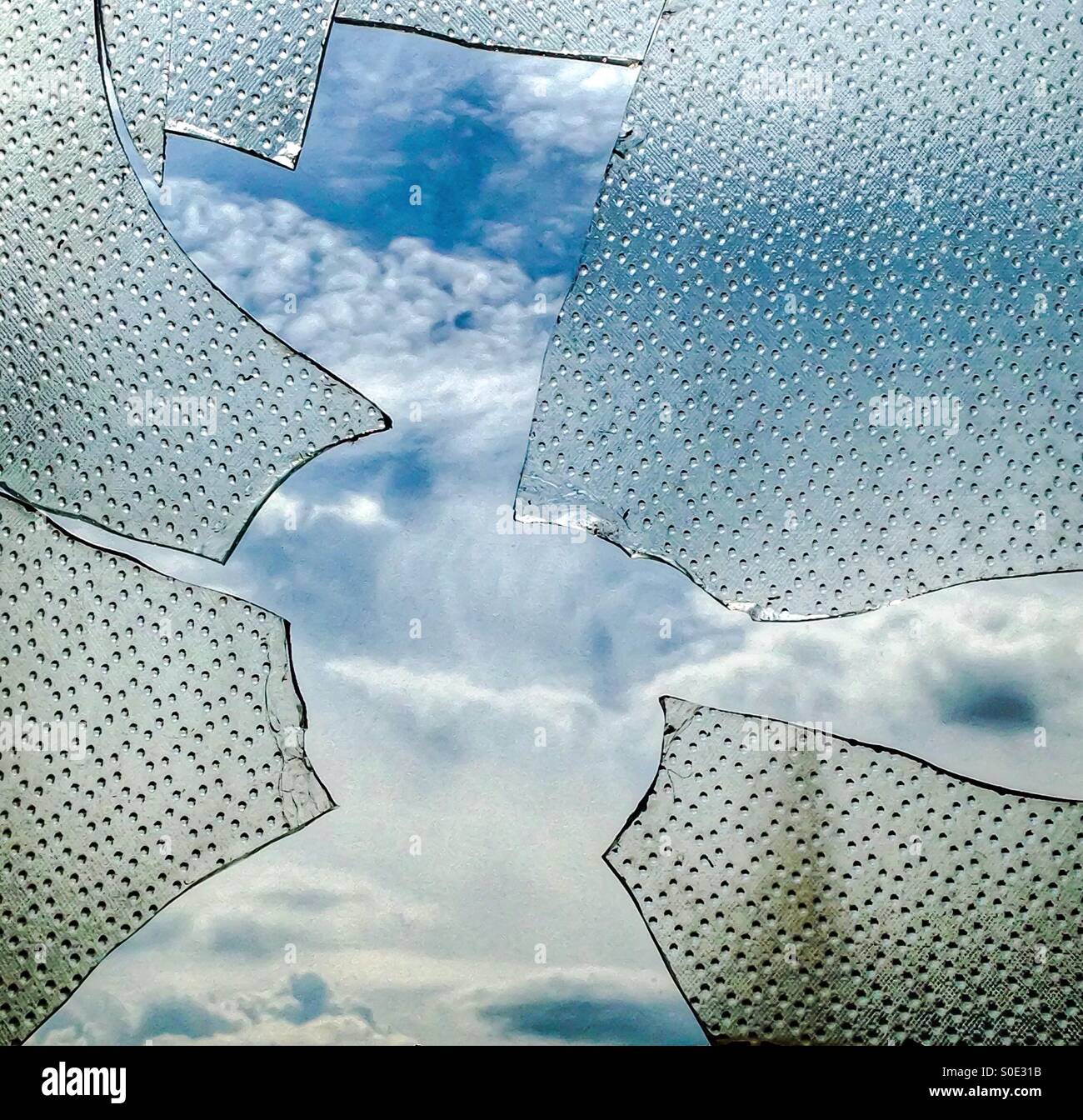 A view of the sky through a broken window Stock Photo - Alamy