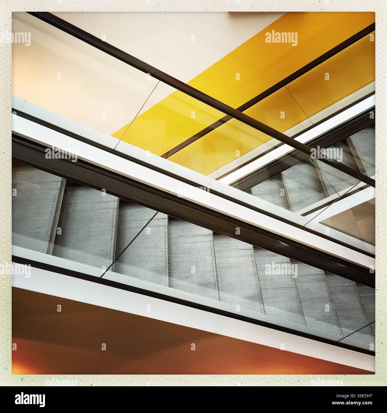 Yellow escalators hi-res stock photography and images - Alamy