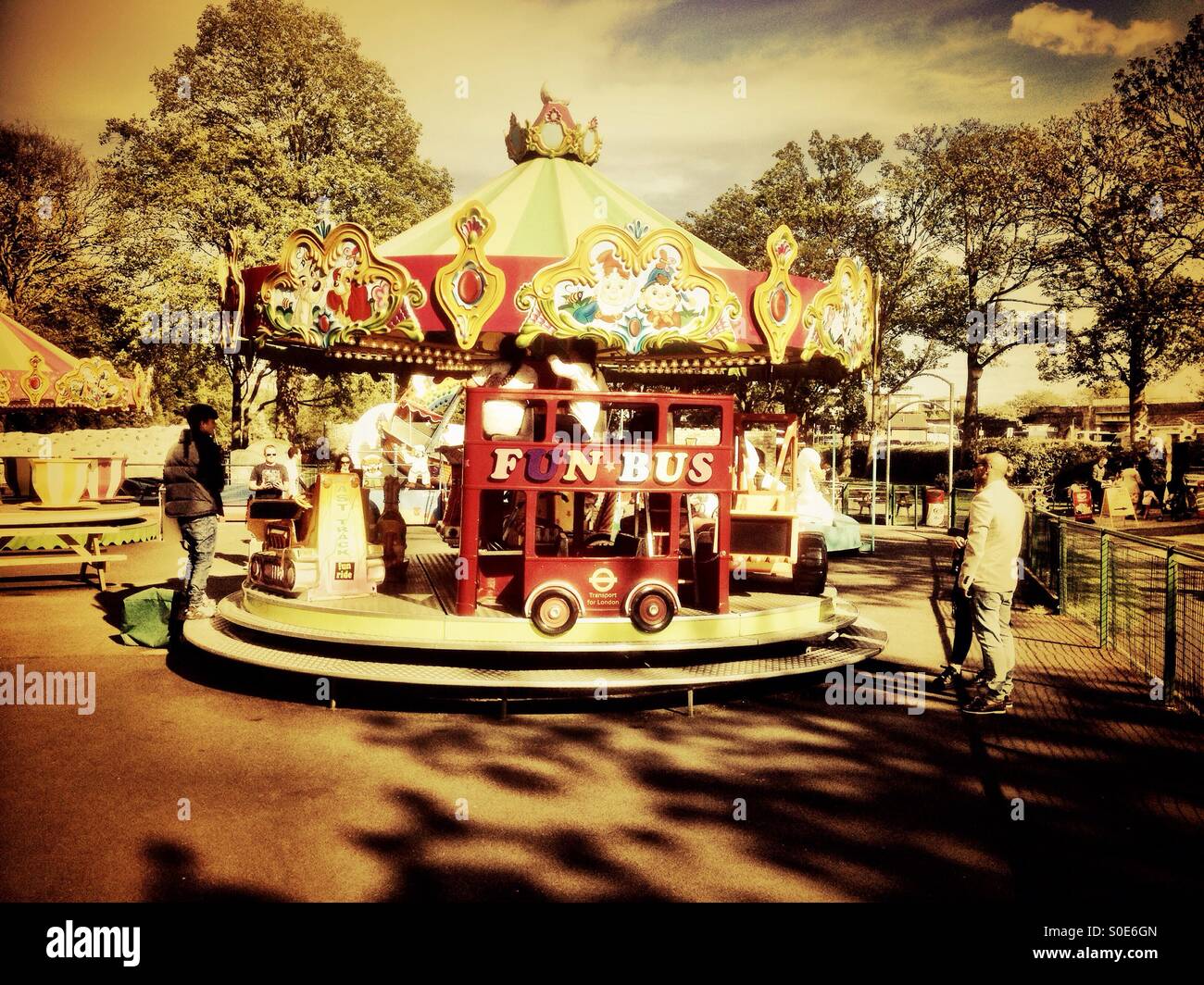 Merry go round cars hi-res stock photography and images - Alamy