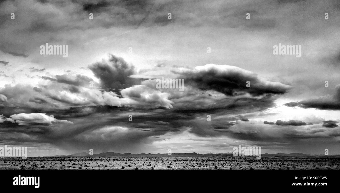 Clouds over the desert Stock Photo - Alamy