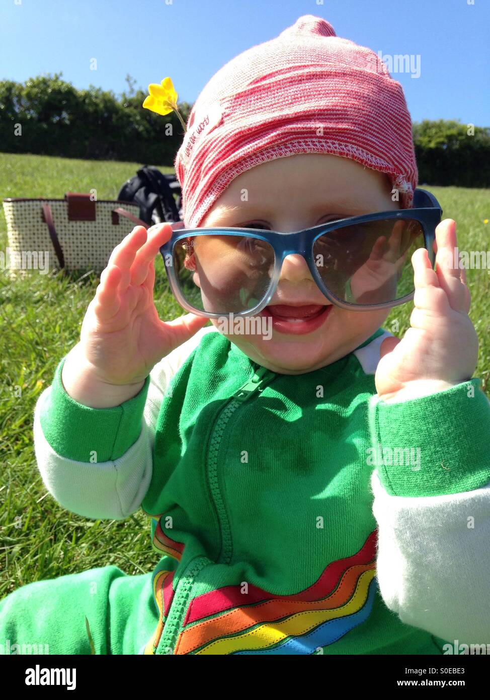 Happy baby playing in the sun Stock Photo - Alamy