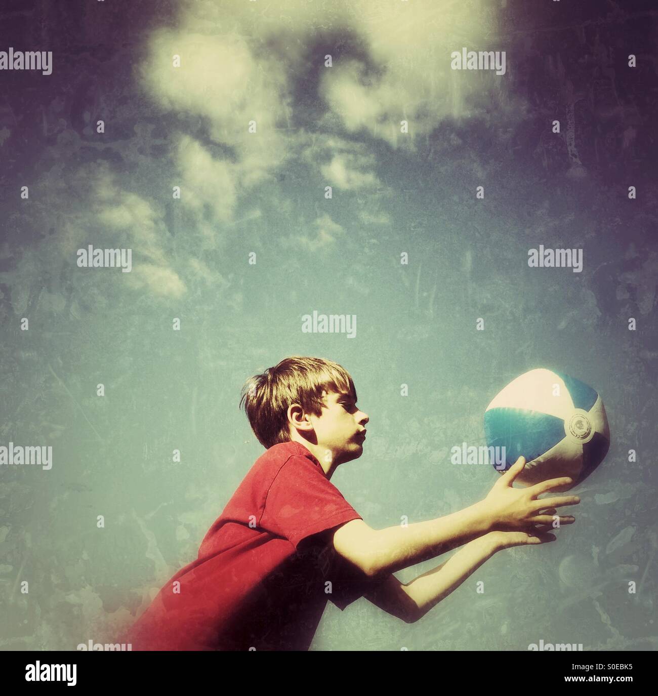 Child catching ball hi-res stock photography and images - Alamy