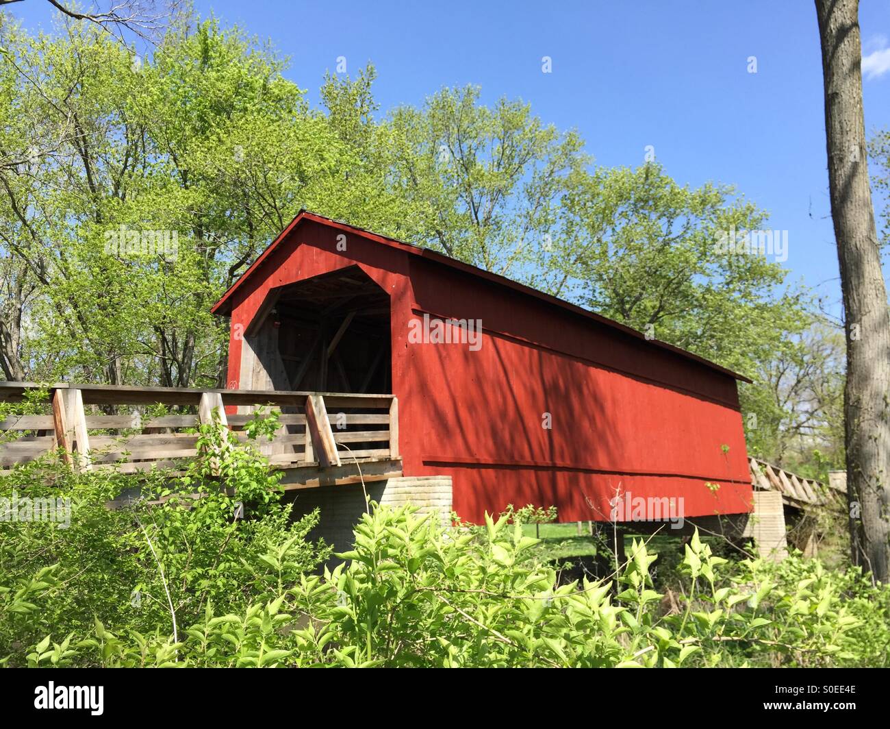 Red covered bridge Stock Photo - Alamy