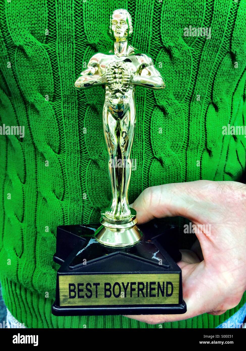Man holds his 'best boyfriend' trophy Stock Photo - Alamy