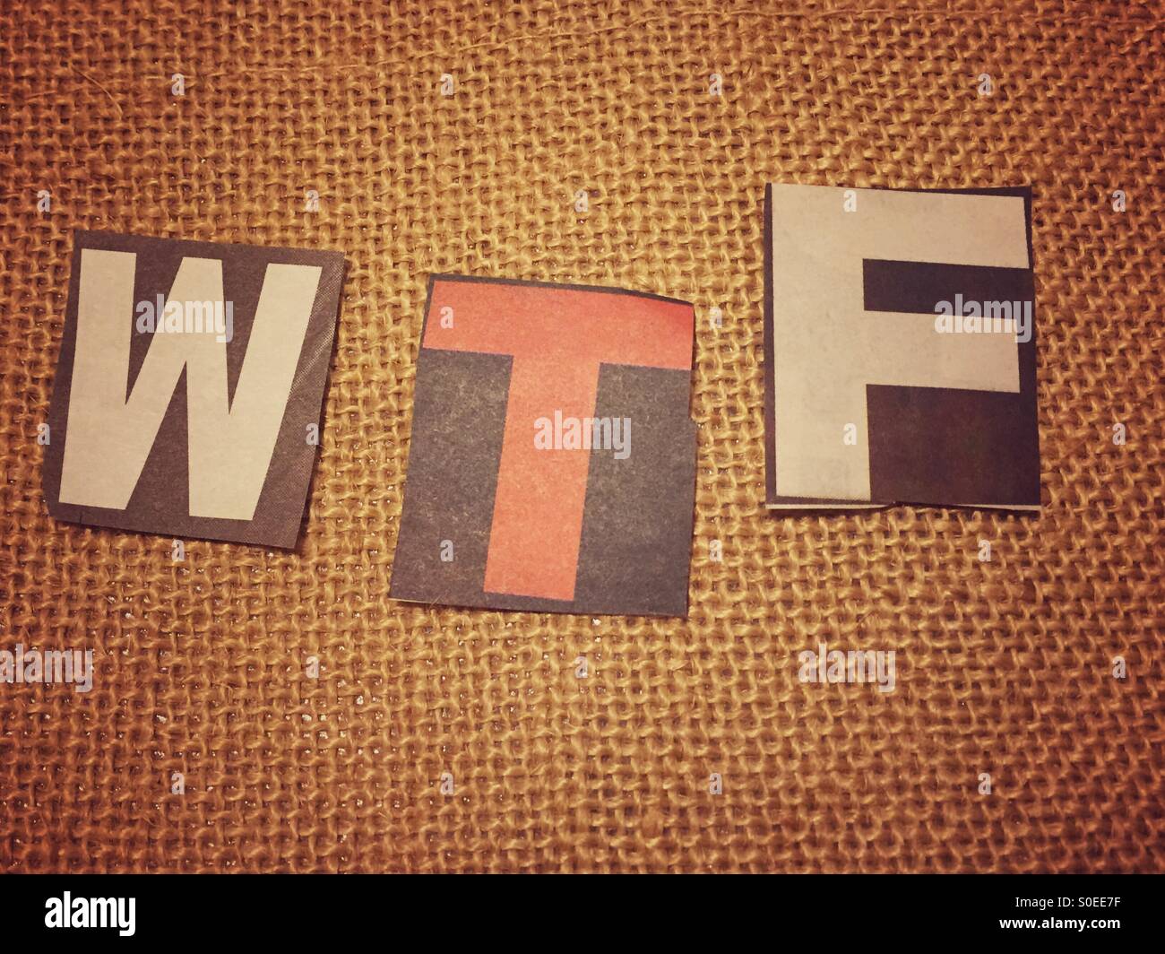 The word WTF made up of letter cut out of a newspaper Stock Photo - Alamy