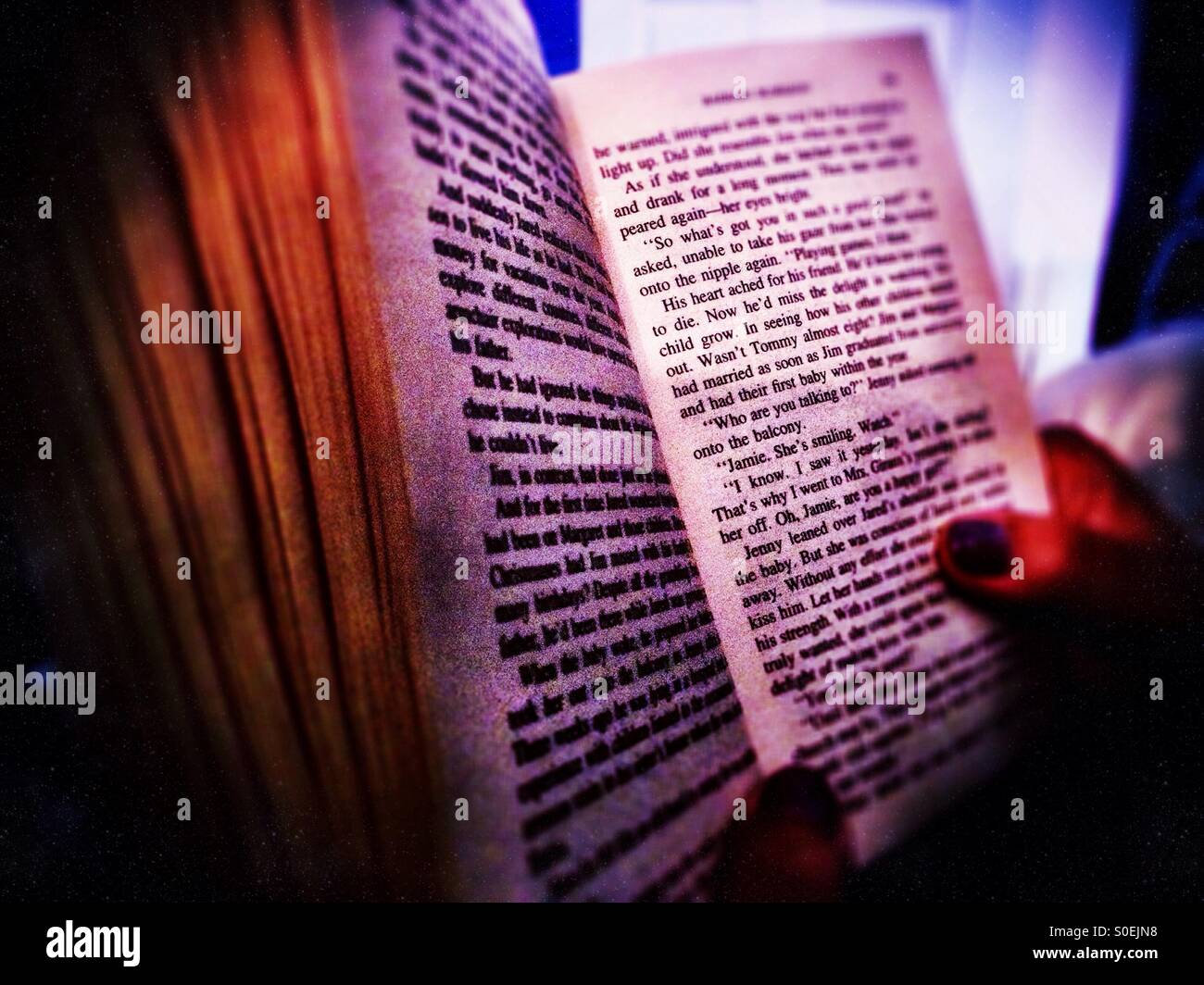 Reading a book Stock Photo - Alamy