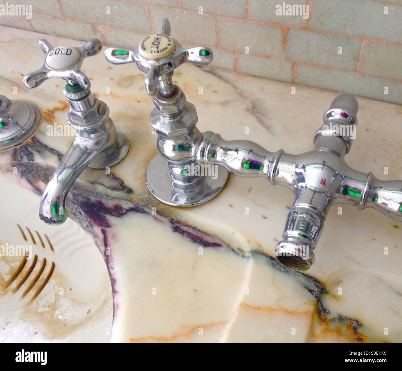 Old bathroom taps Stock Photo - Alamy
