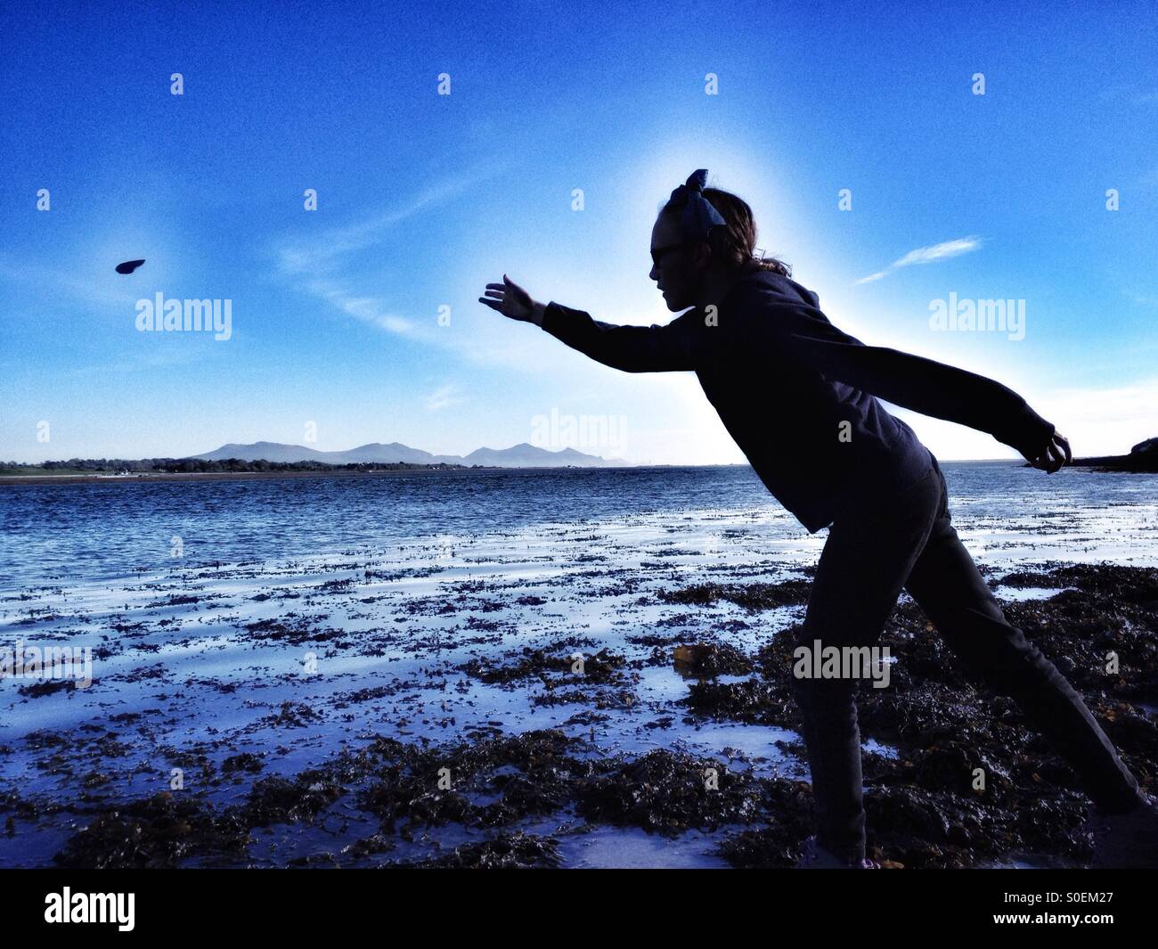 Girl throwing stones hi-res stock photography and images - Alamy