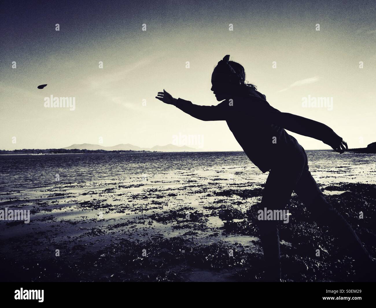 Girl throwing stones hi-res stock photography and images - Alamy