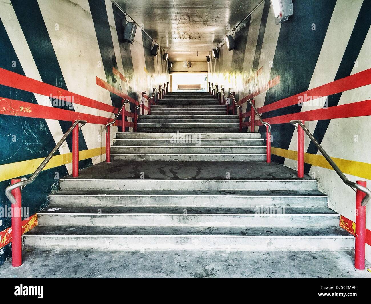 Pedestrian underpass with stairs and painted walls Stock Photo - Alamy