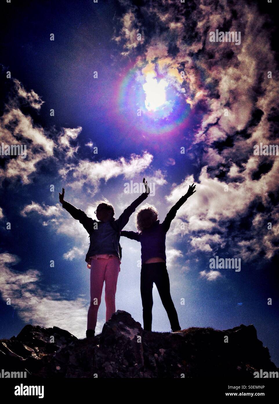 Two children celebrating reaching summit Stock Photo - Alamy