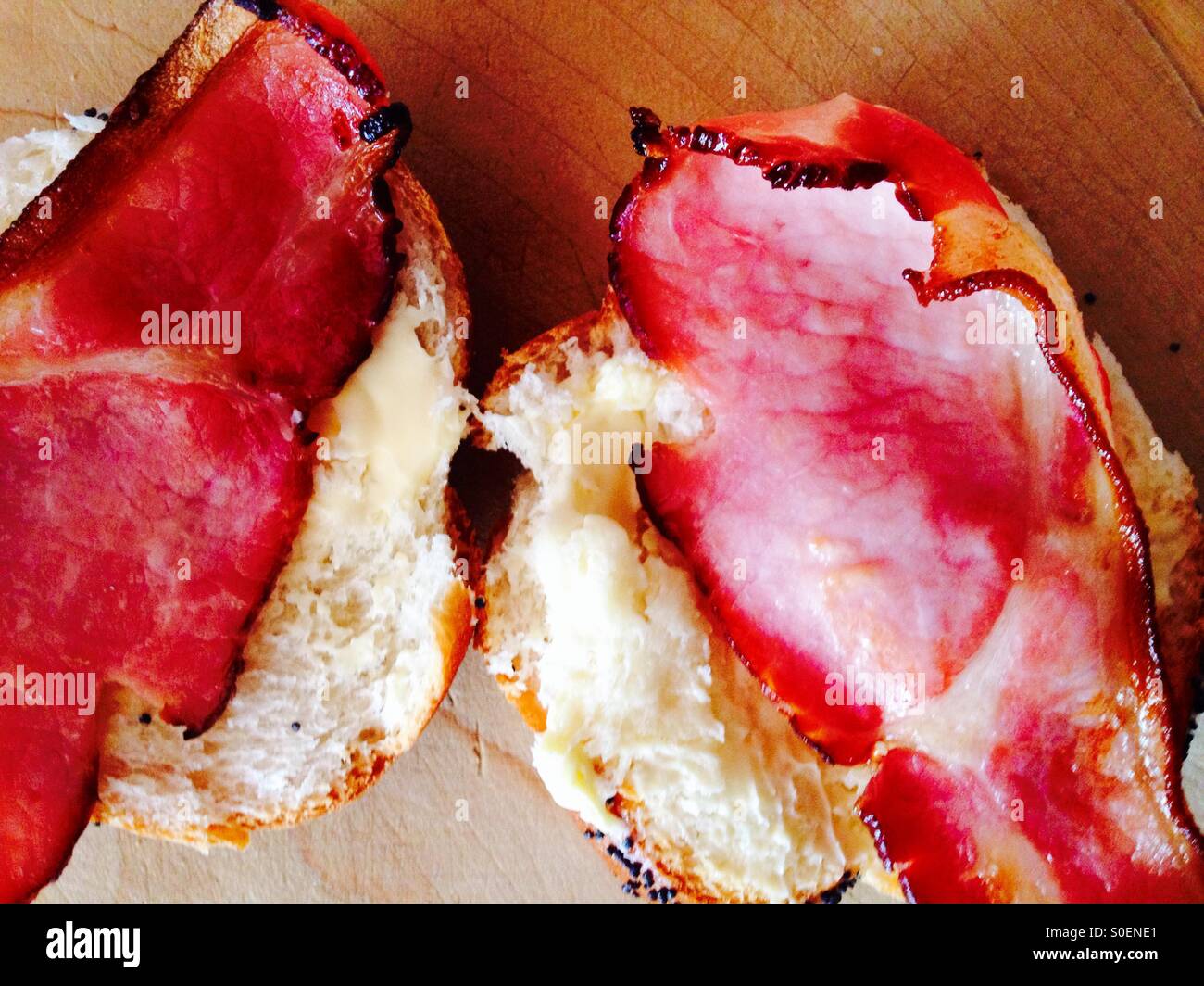 Grilled bacon open roll Stock Photo - Alamy