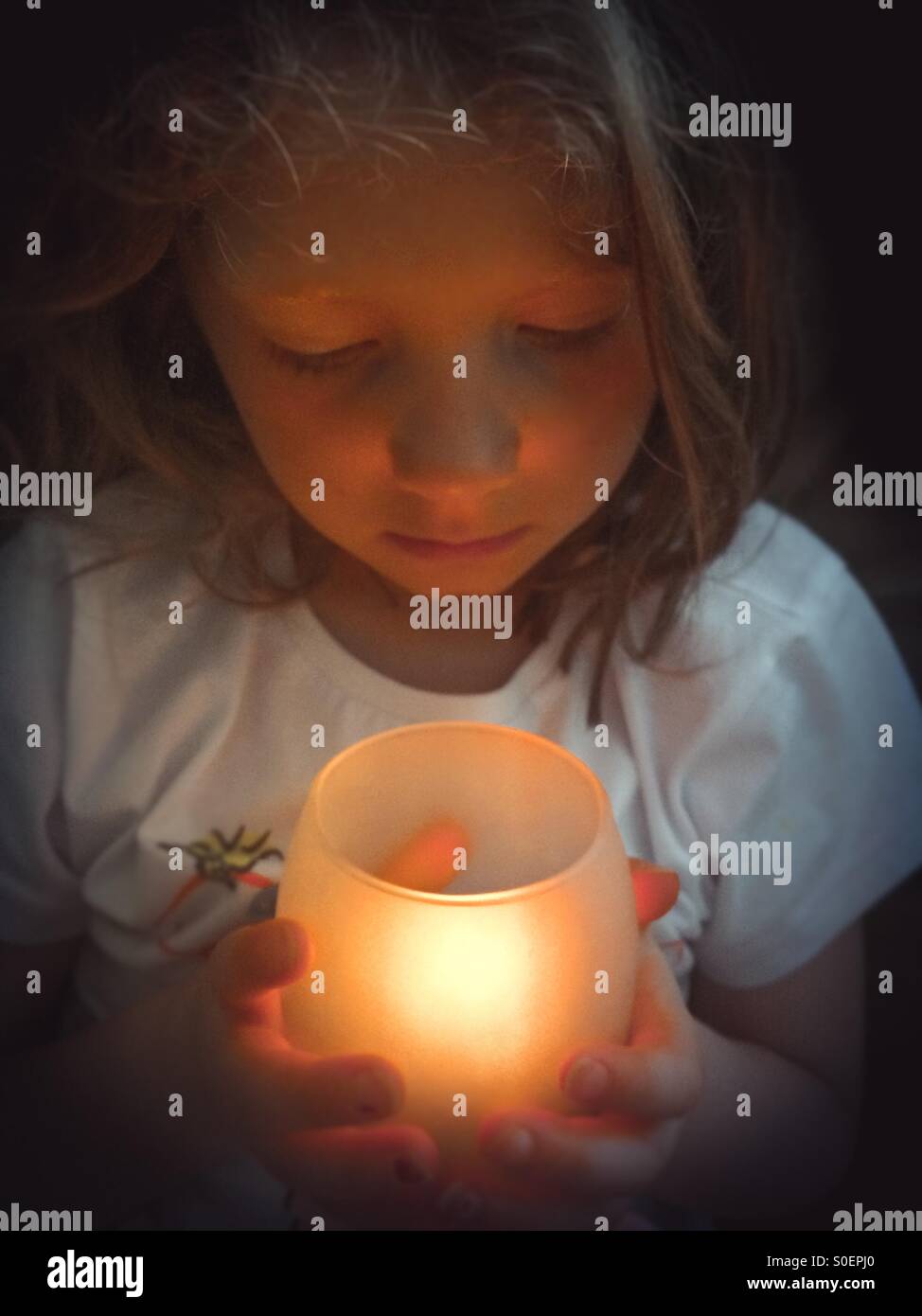 Girl and Candle Stock Photo - Alamy
